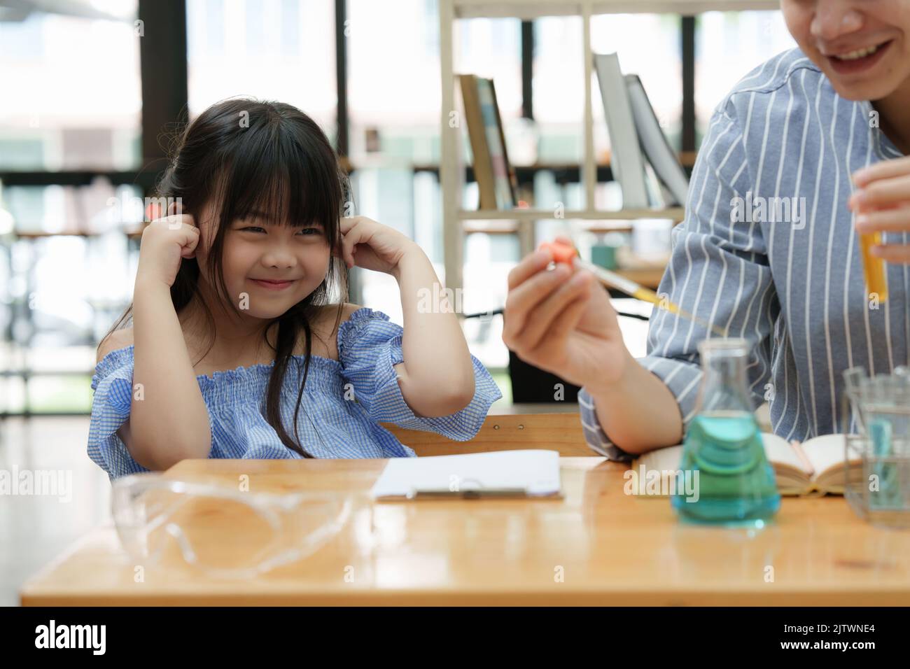 Kid and father doing science experiments. Education science concept ...