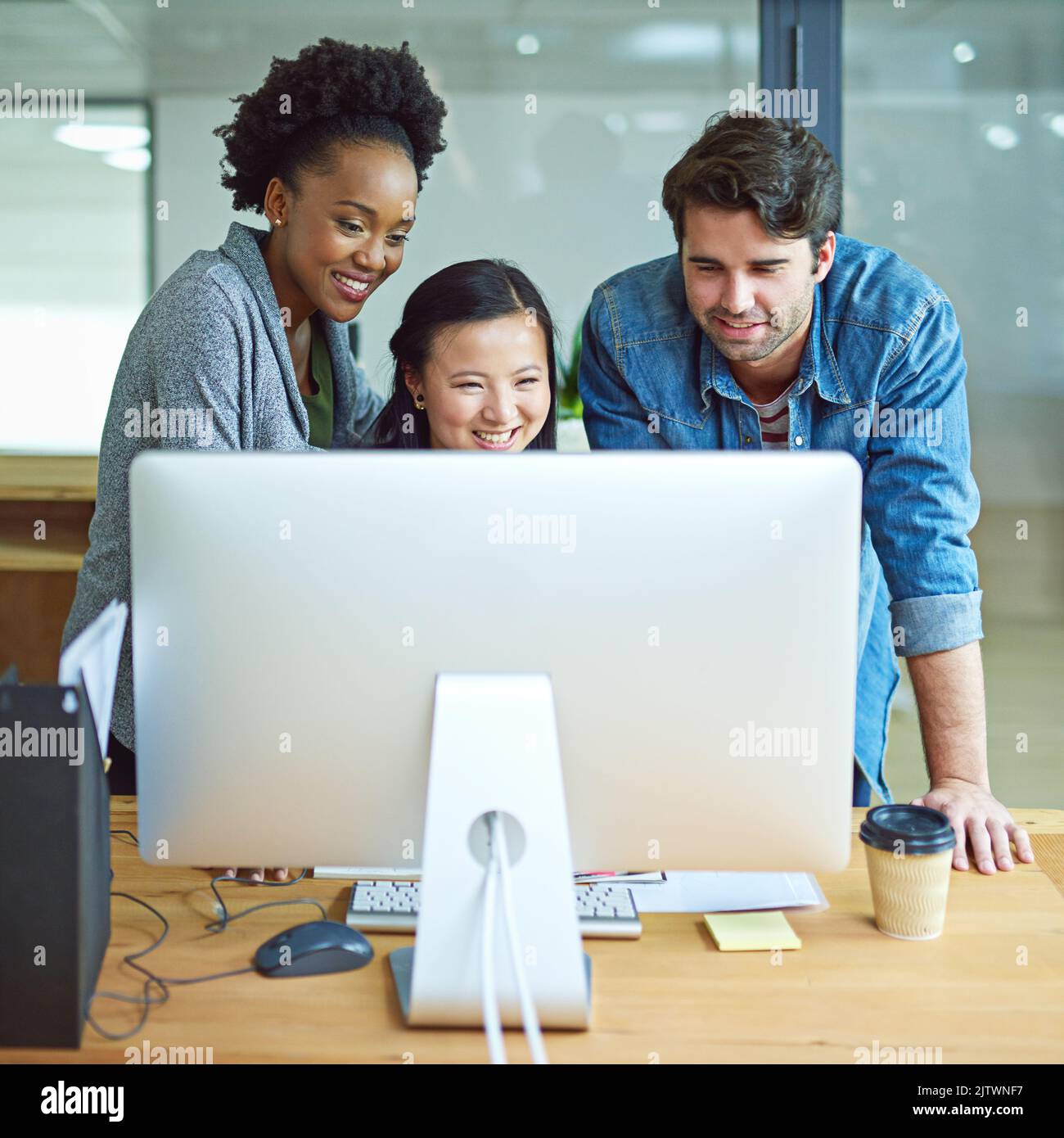 Three heads are better than one. a group of creative businesspeople ...