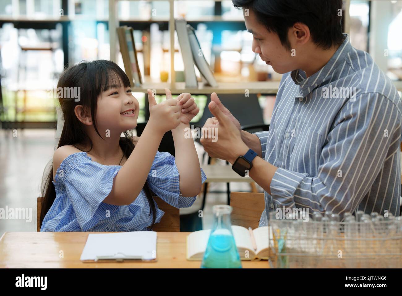 Kid and father doing science experiments. Education science concept ...