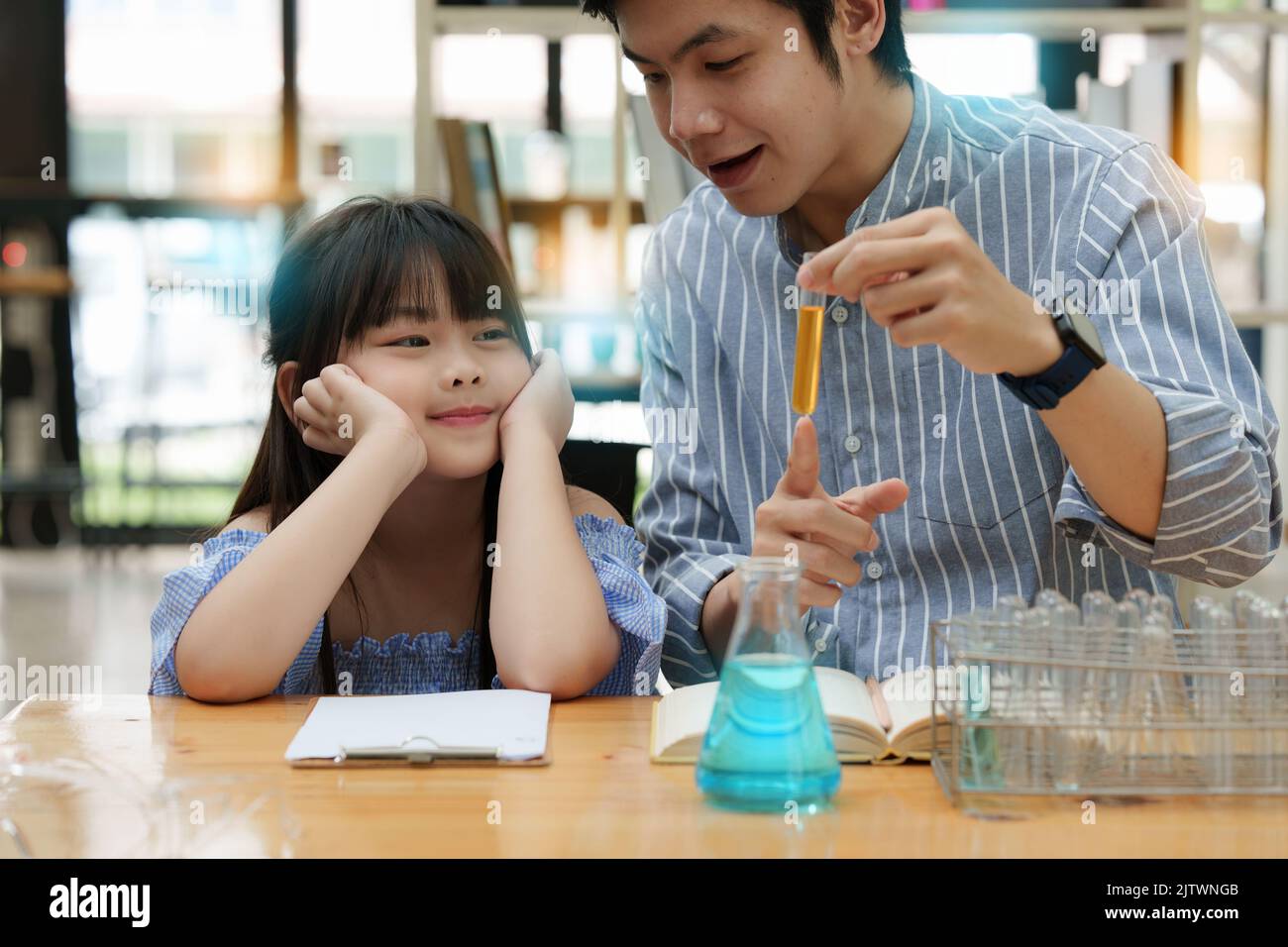 Kid and father doing science experiments. Education science concept ...