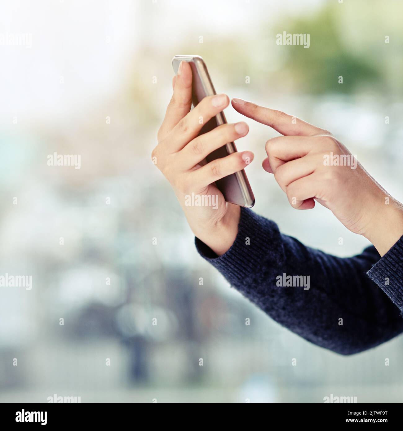 As easy as scroll, tap, swipe. an unidentifiable businesswoman using a ...