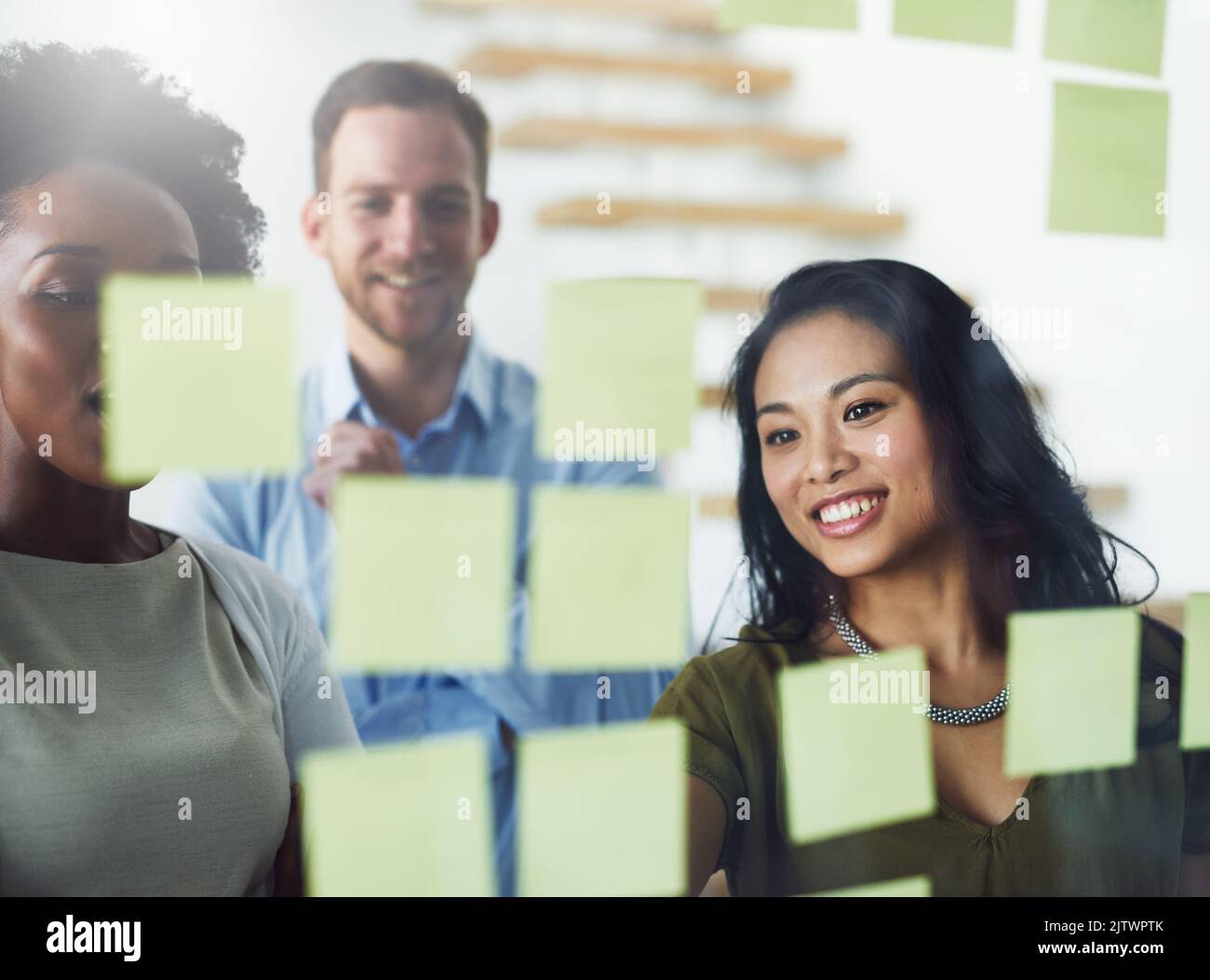 Working on their plan of action. a group of businesspeople working on a ...