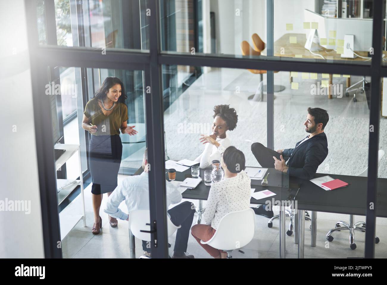 Handling their questions with ease. High angle shot of a businesswoman ...