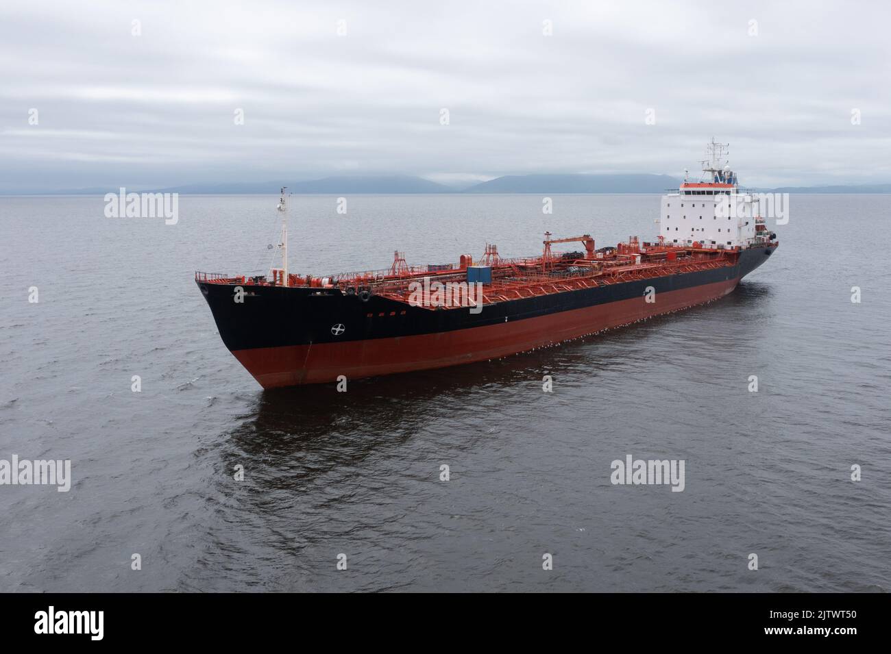 The sea tanker in the middle of a gulf Stock Photo - Alamy