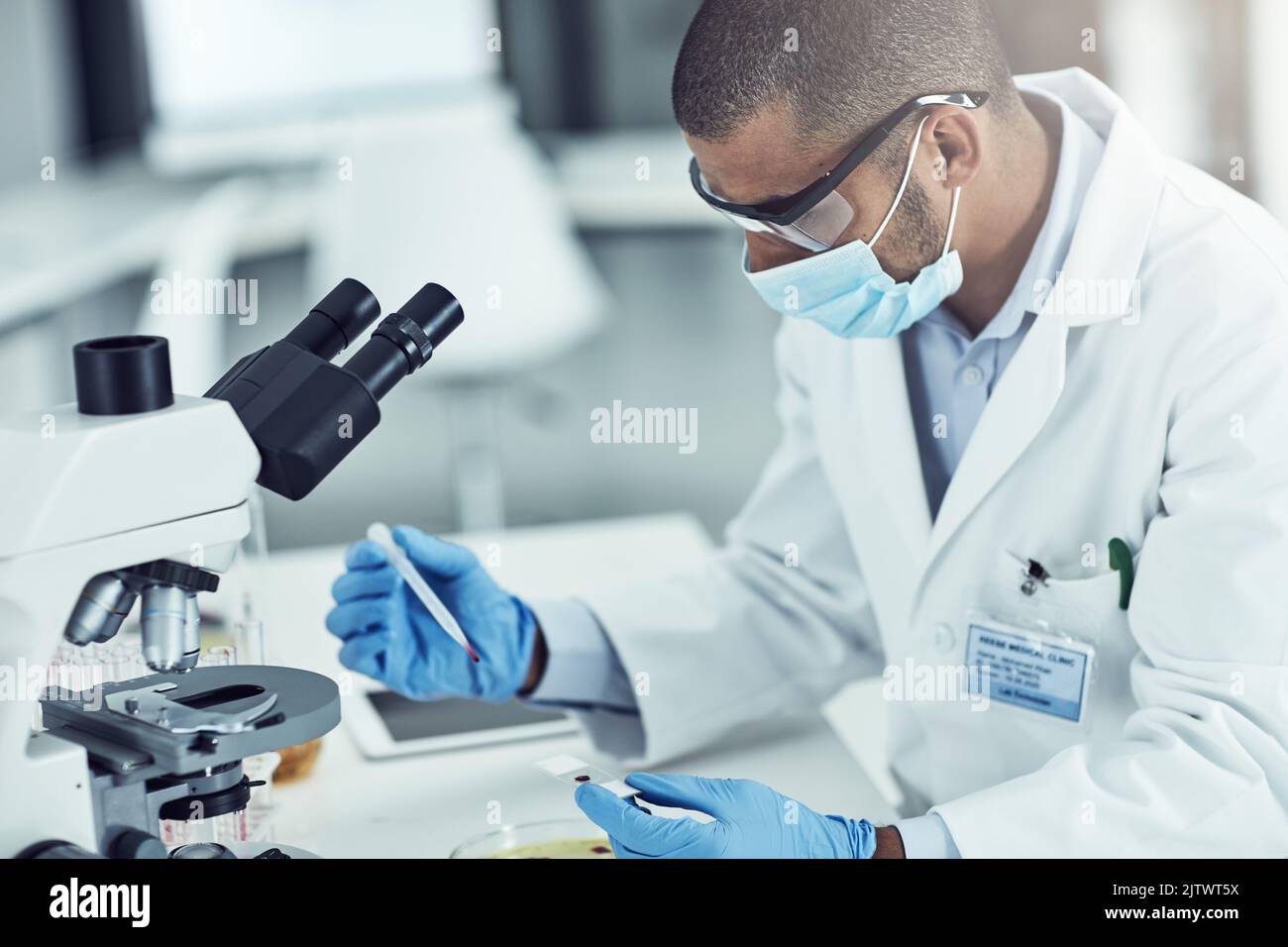 He has strong problem-solving skills. a young male scientist working in ...