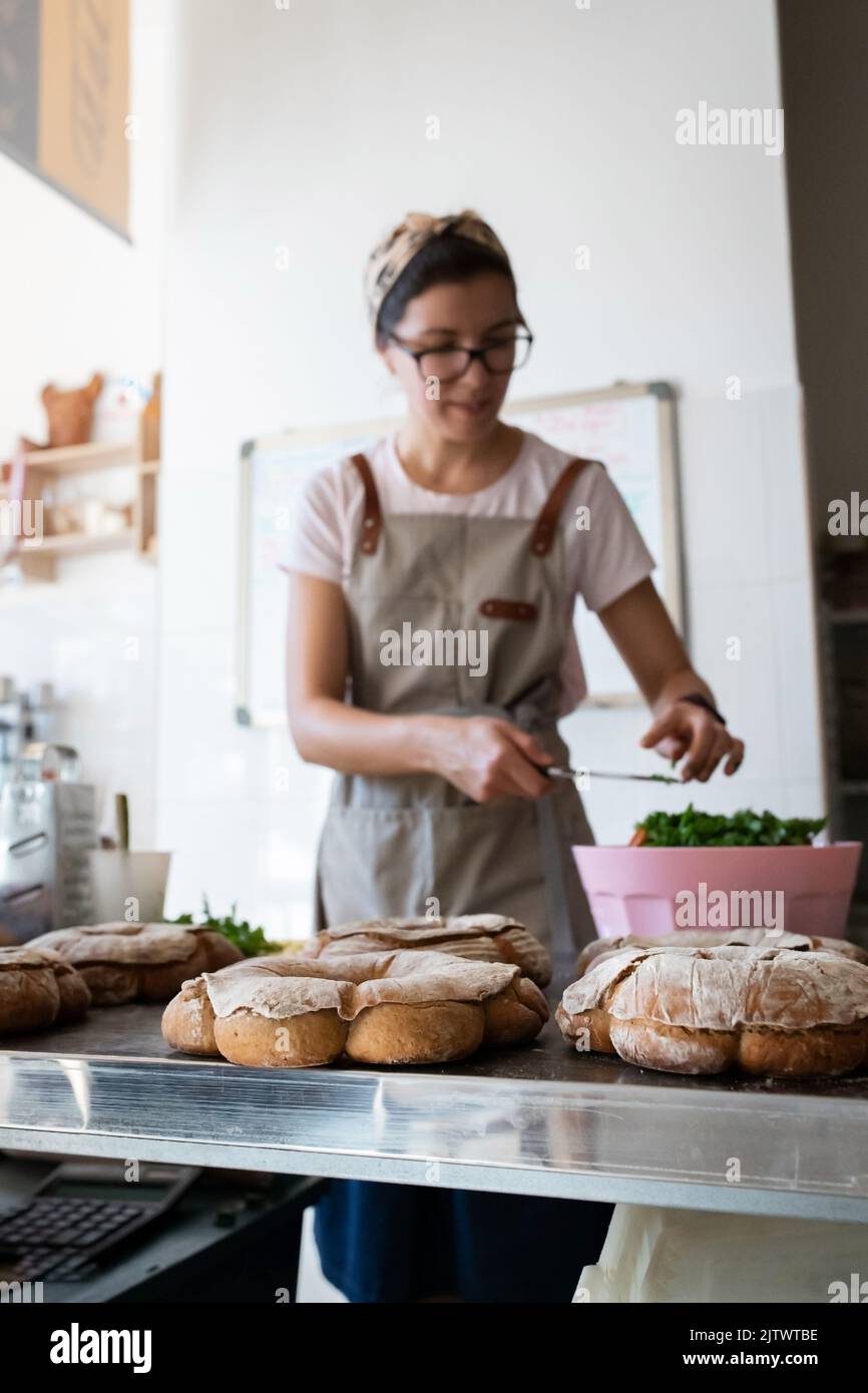 Finished French bread in the bakery on the table. Rustic bread, the ...