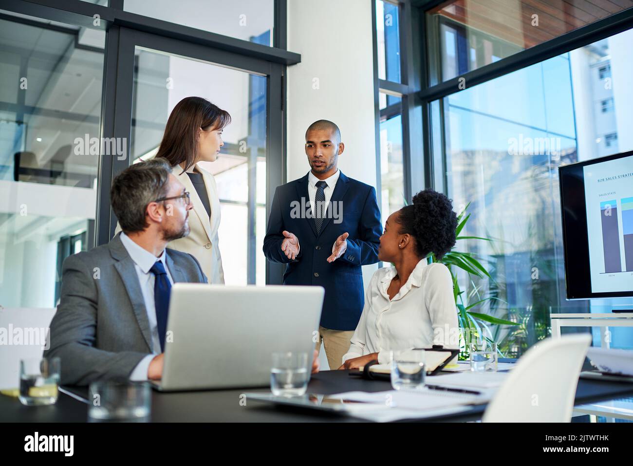 Getting his point across to the team. a group of business colleagues ...