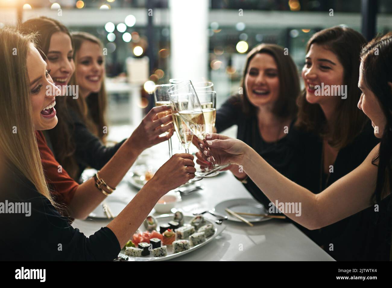 Good food, good friends, good times. friends having a dinner party at a ...