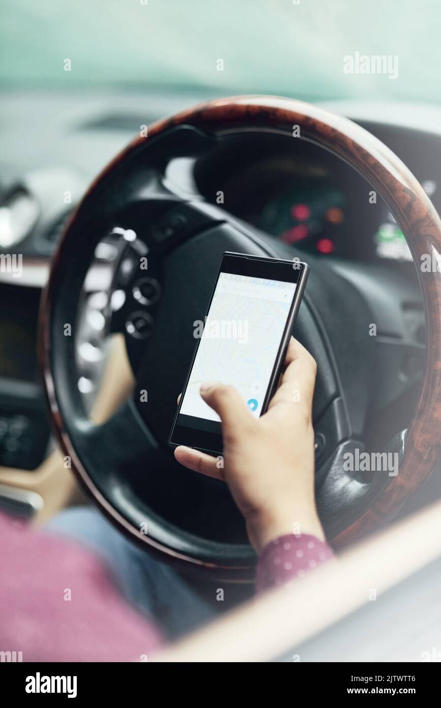Plan your route in real time with this app. Closeup shot of a driver ...