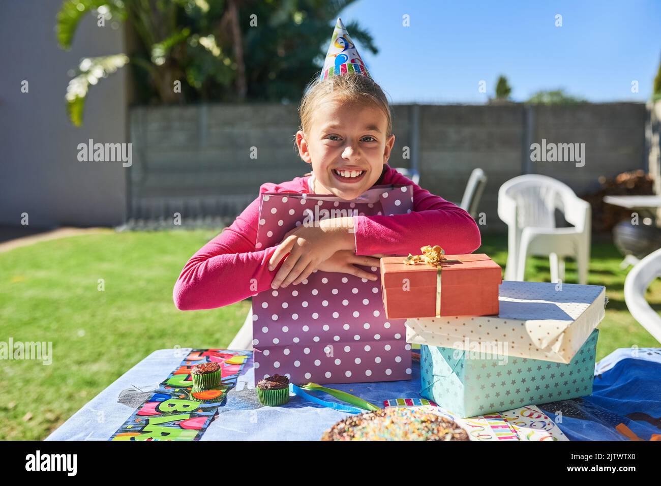 So many presents and theyre all for me. Portrait of a happy little girl ...