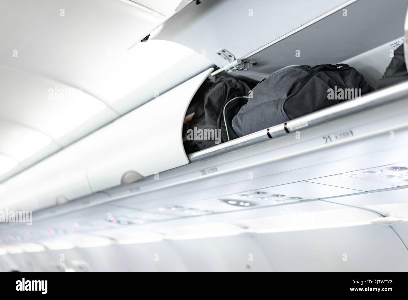 Backpack on seat plane hi-res stock photography and images - Alamy