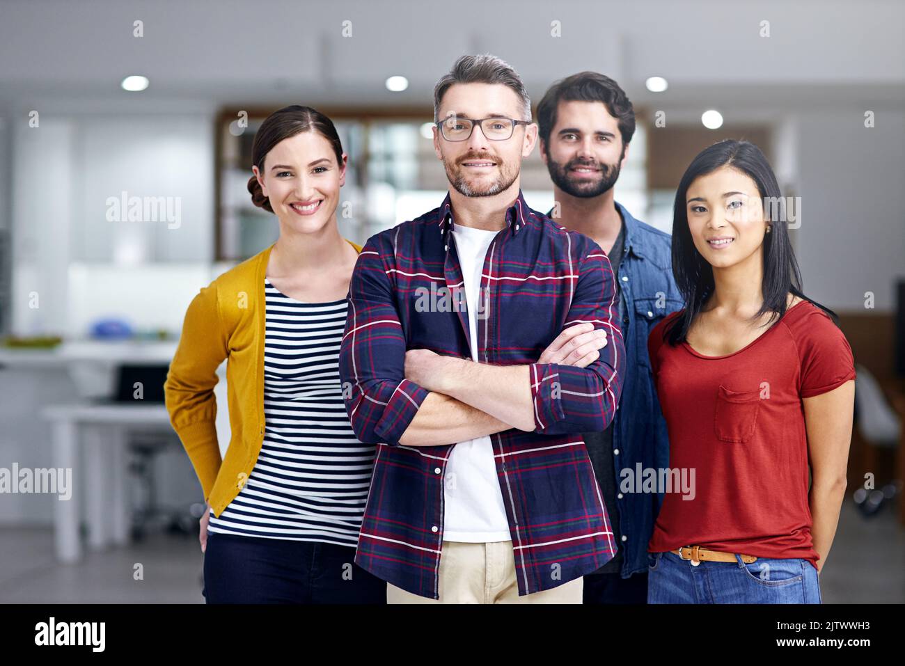 Confidence is empowering. Portrait of a group of creatives standing ...