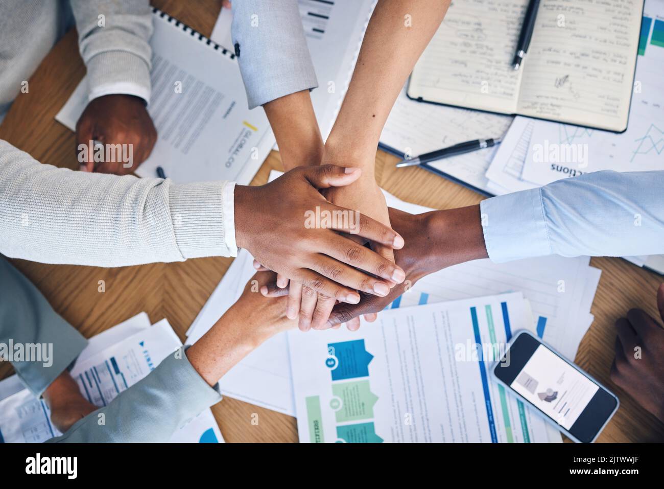 Teamwork, office and collaboration of hands at work together to show ...