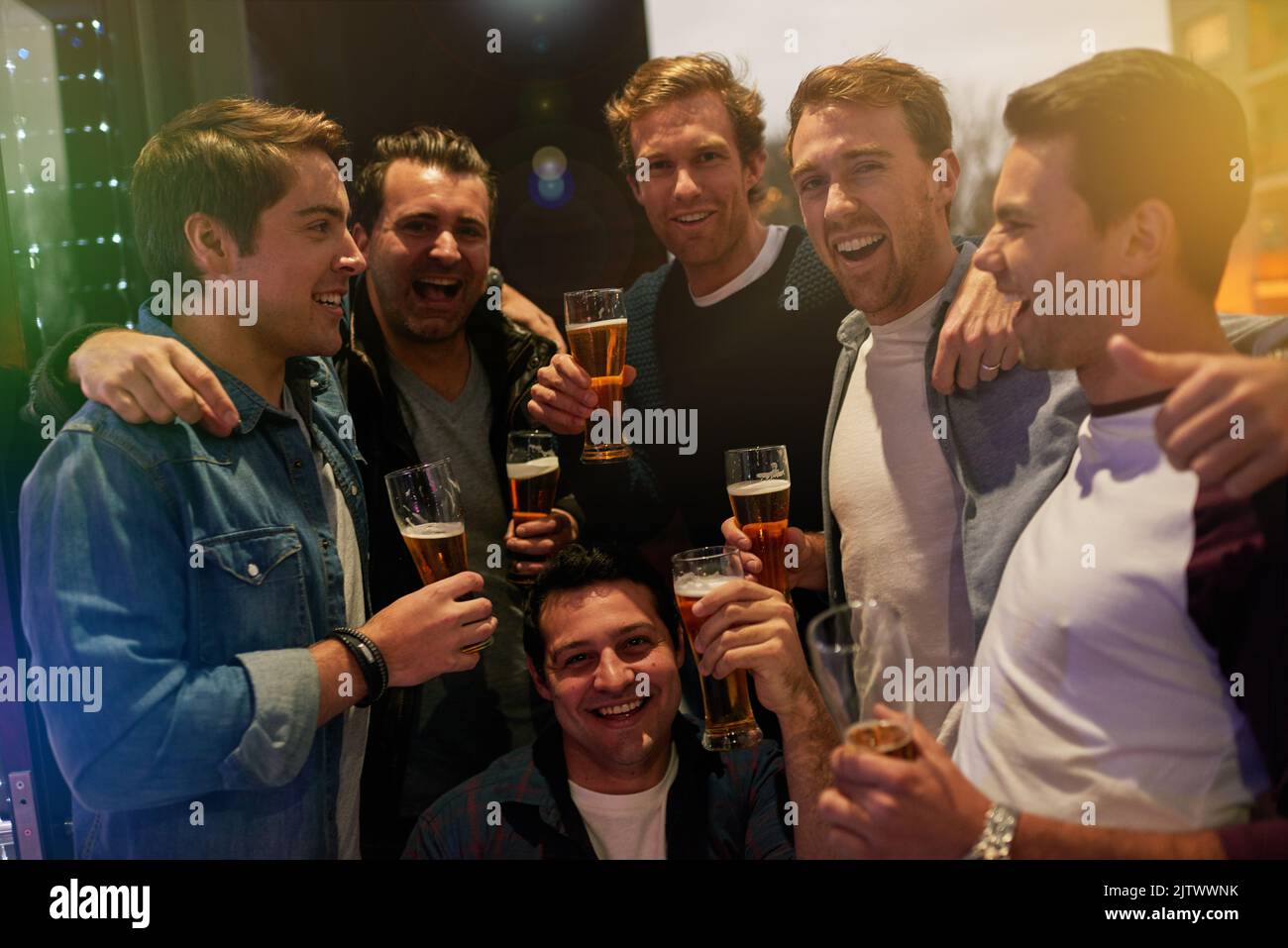 The boys are back in town. Cropped portrait of guys drinking beer at a party Stock Photo - Alamy