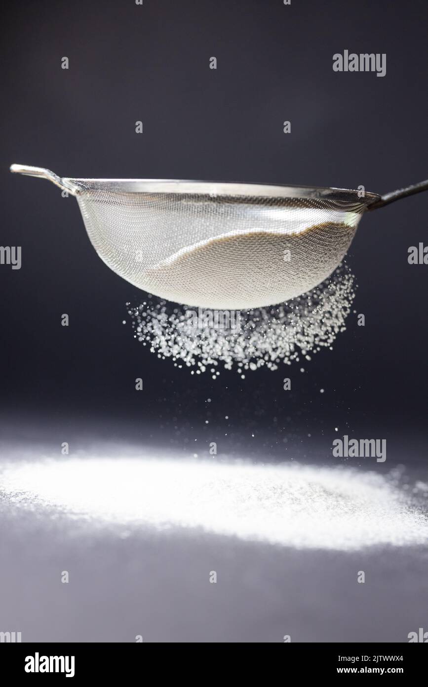 Sifting flour through sieve against hi-res stock photography and images ...