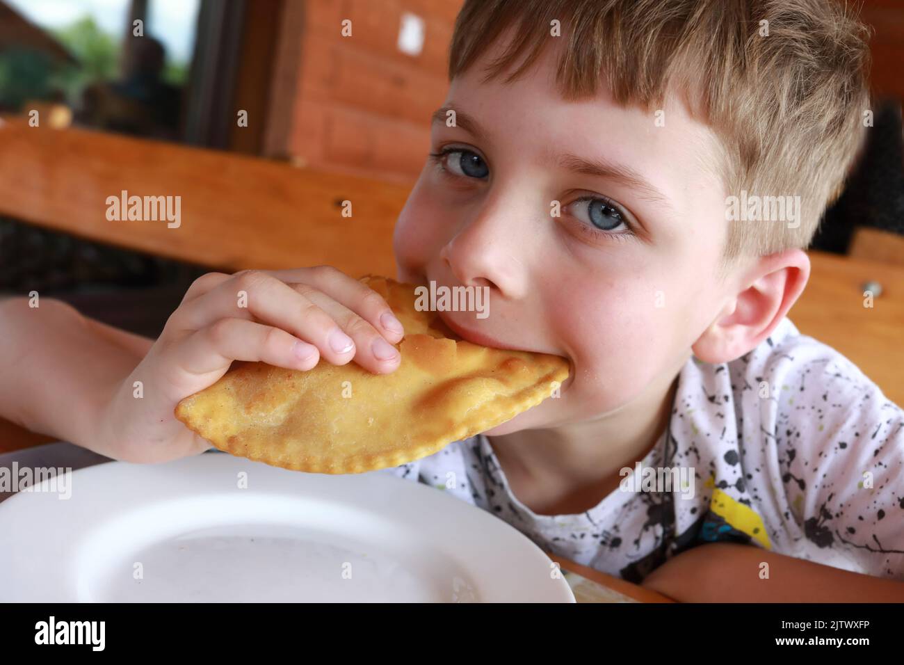 Boy eating pie lunch hi-res stock photography and images - Alamy