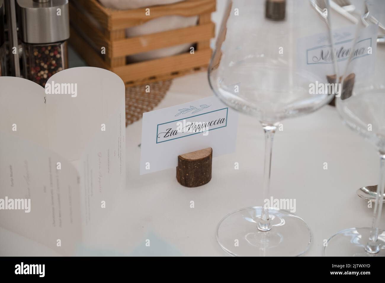 A closeup of a place setting with name tag on table at wedding banquet ...