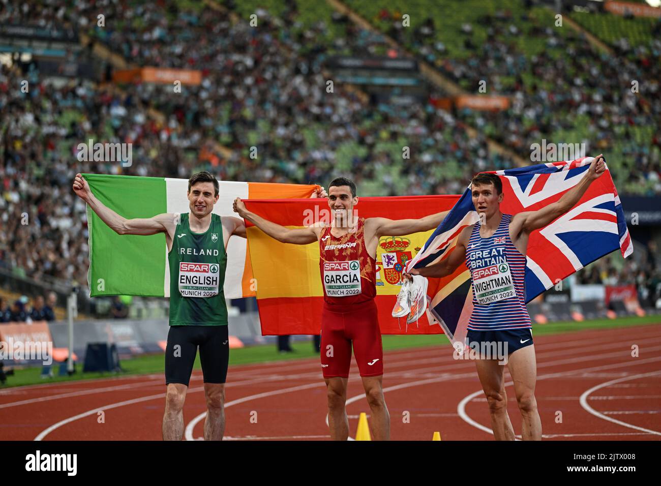 Mariano Garcia, Jake Wightman and Mark English with her country's flag ...
