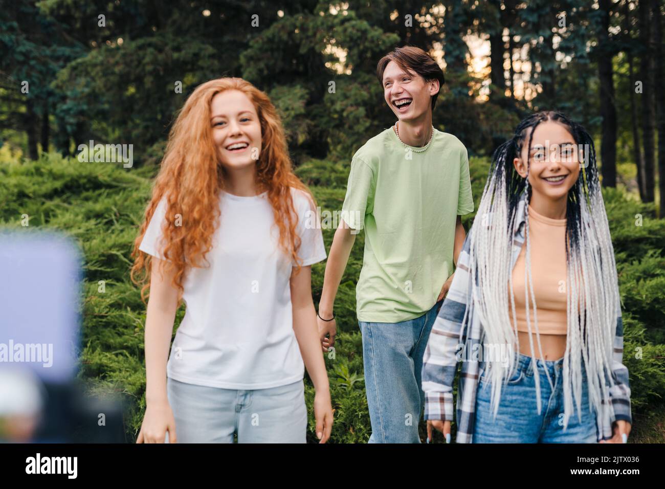 Teenagers, beginner bloggers, having fun making videos for followers ...