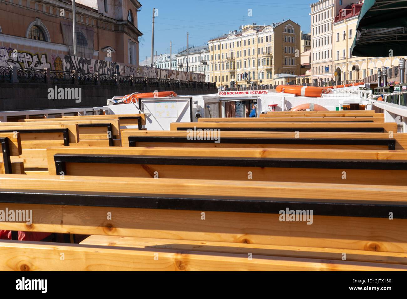 RUSSIA, PETERSBURG - AUG 20, 2022: an empty bench Petersburg wooden ...