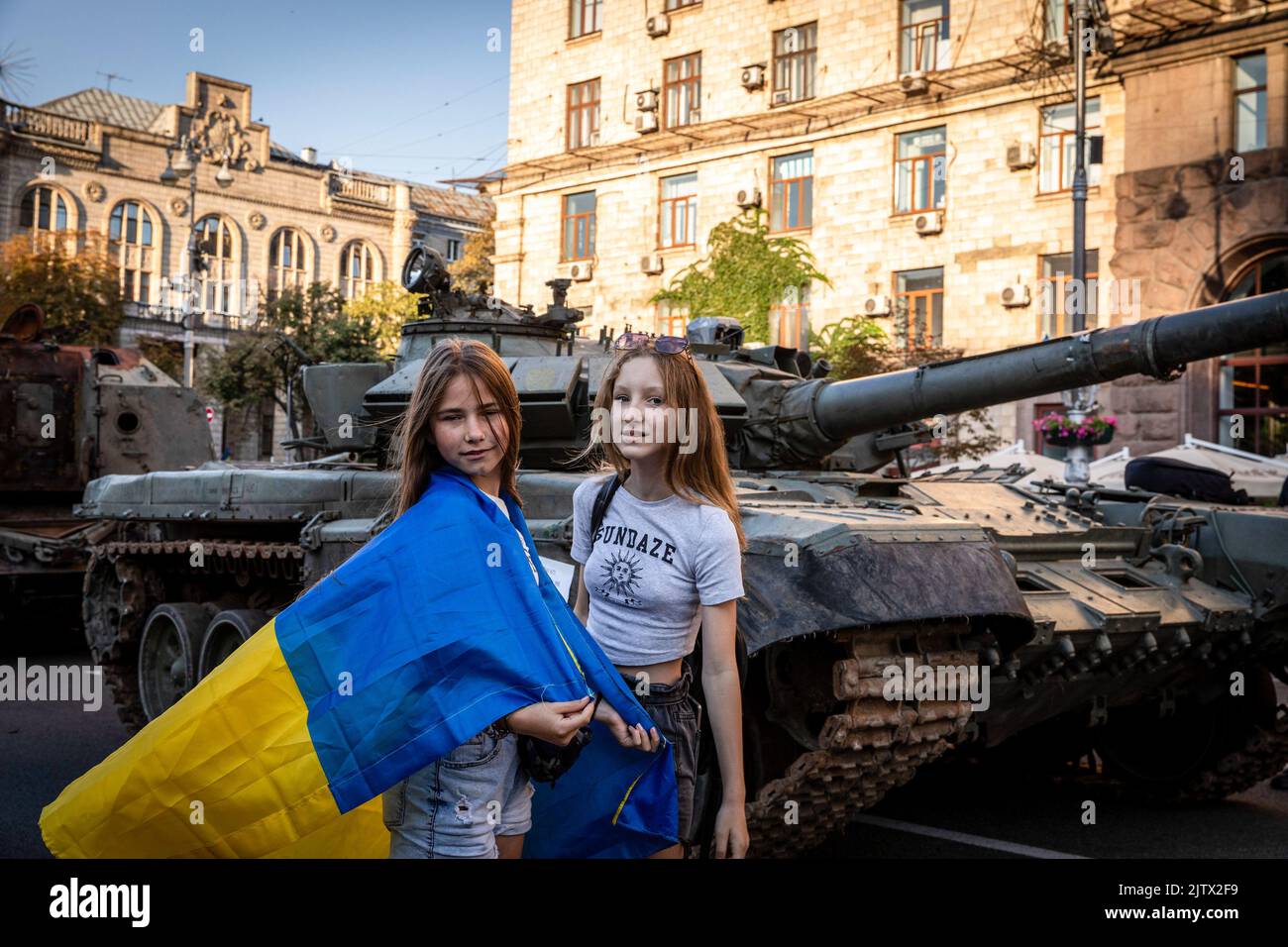 Kyiv, Ukraine. 24th Aug, 2022. Two teenage girls with the Ukrainian ...