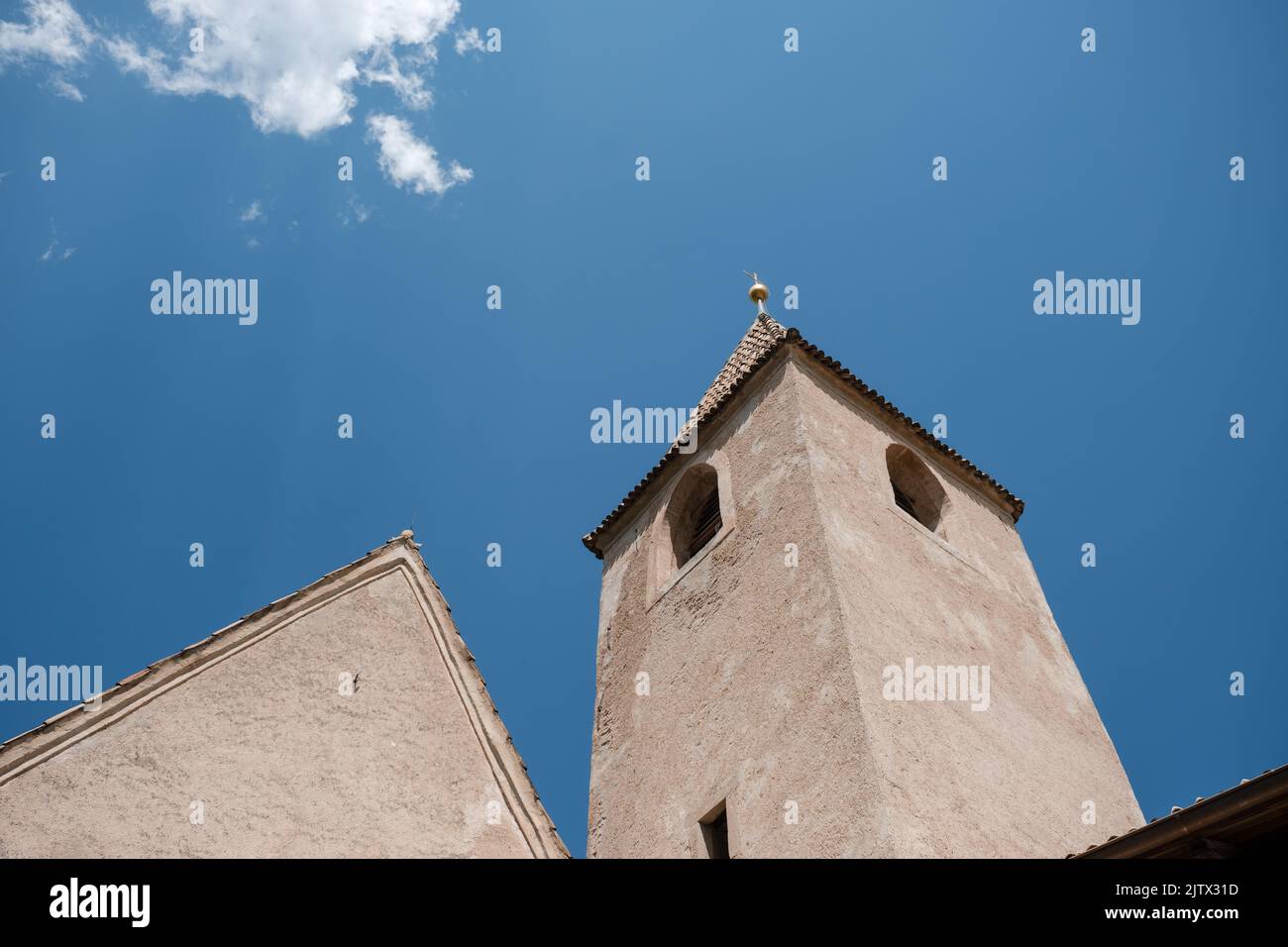 A low angle of a church under a blue sky Stock Photo - Alamy