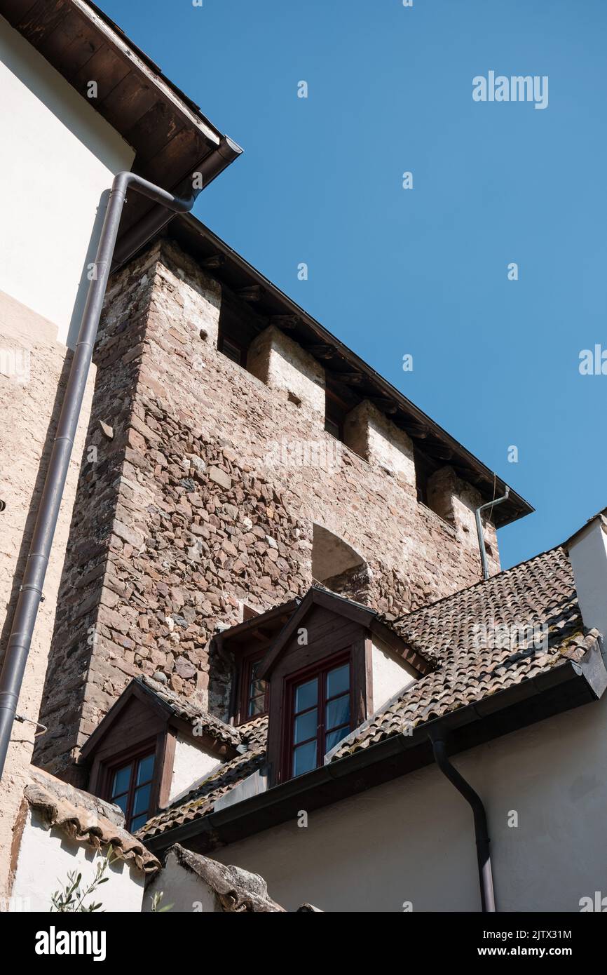 A low angle of a building and its roof with small windows Stock Photo ...