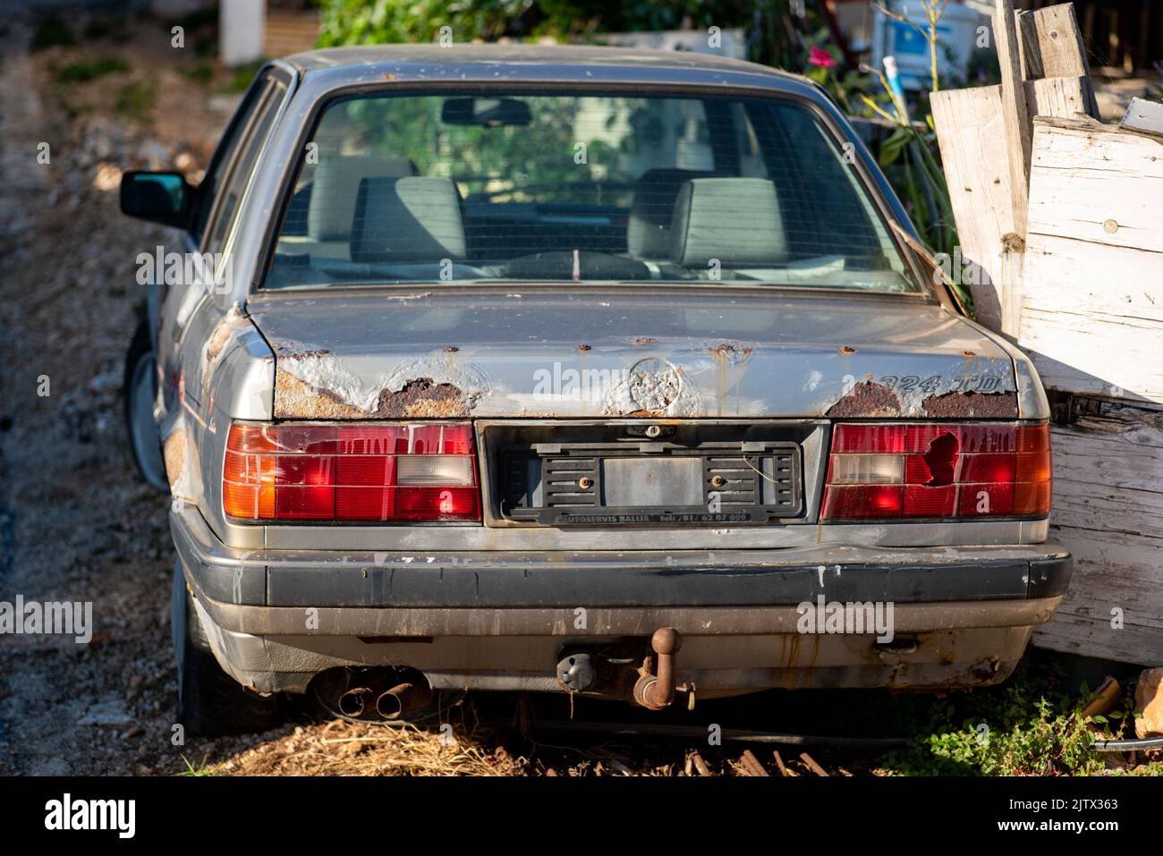 Car left on the street hi-res stock photography and images - Alamy