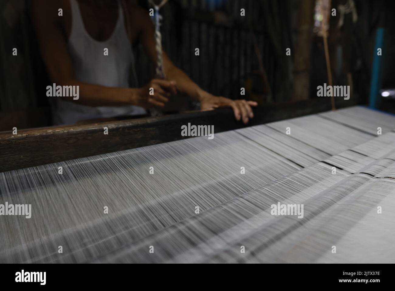 Handloom weaver weaves traditional Lungi, in Keraniganj, near Dhaka ...