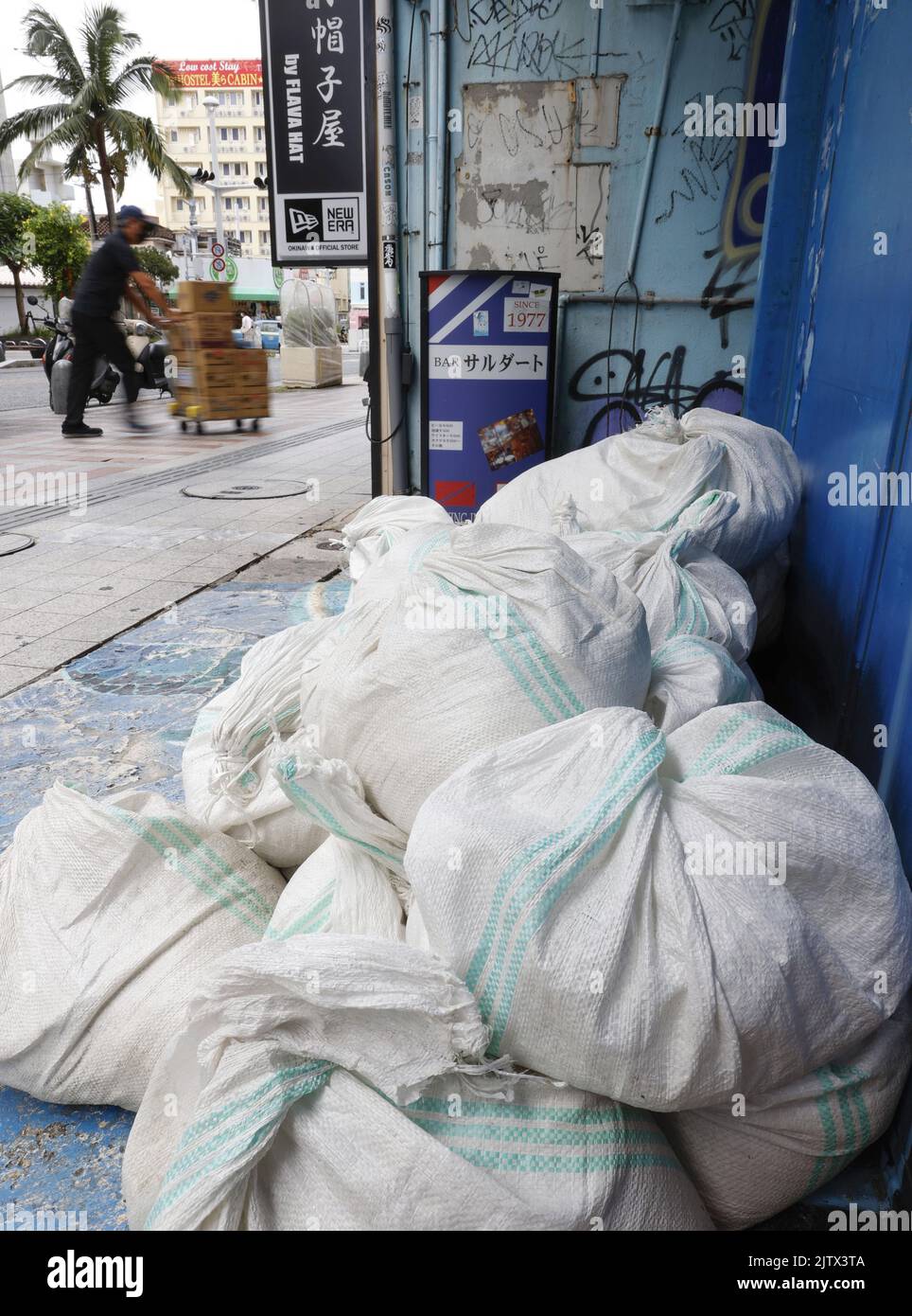 Sandbags are seen outside a store in Naha, Okinawa Prefecture, on Sept ...