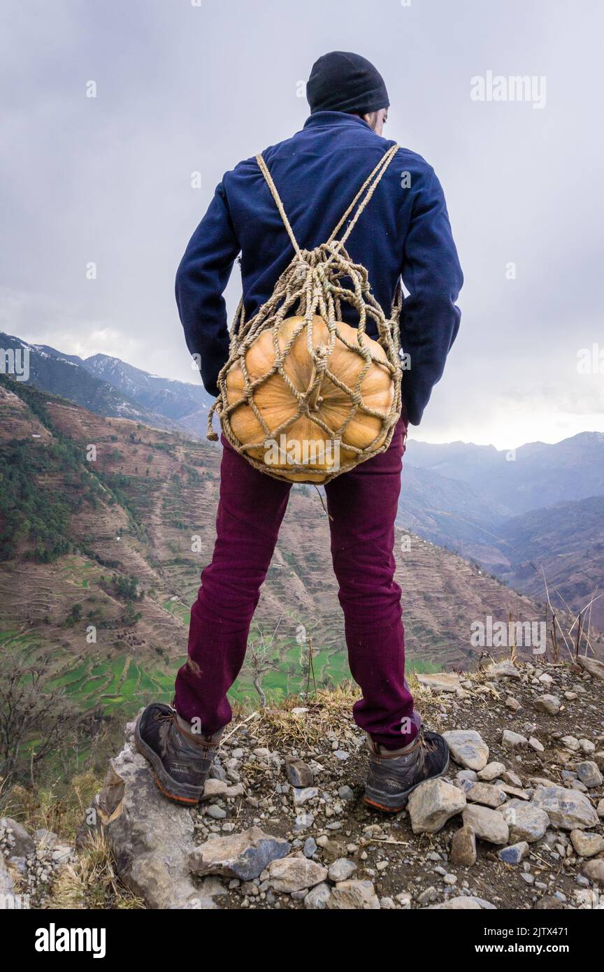 February 5th, 2021. Uttarakhand India.A closeup shot of a man carrying ...