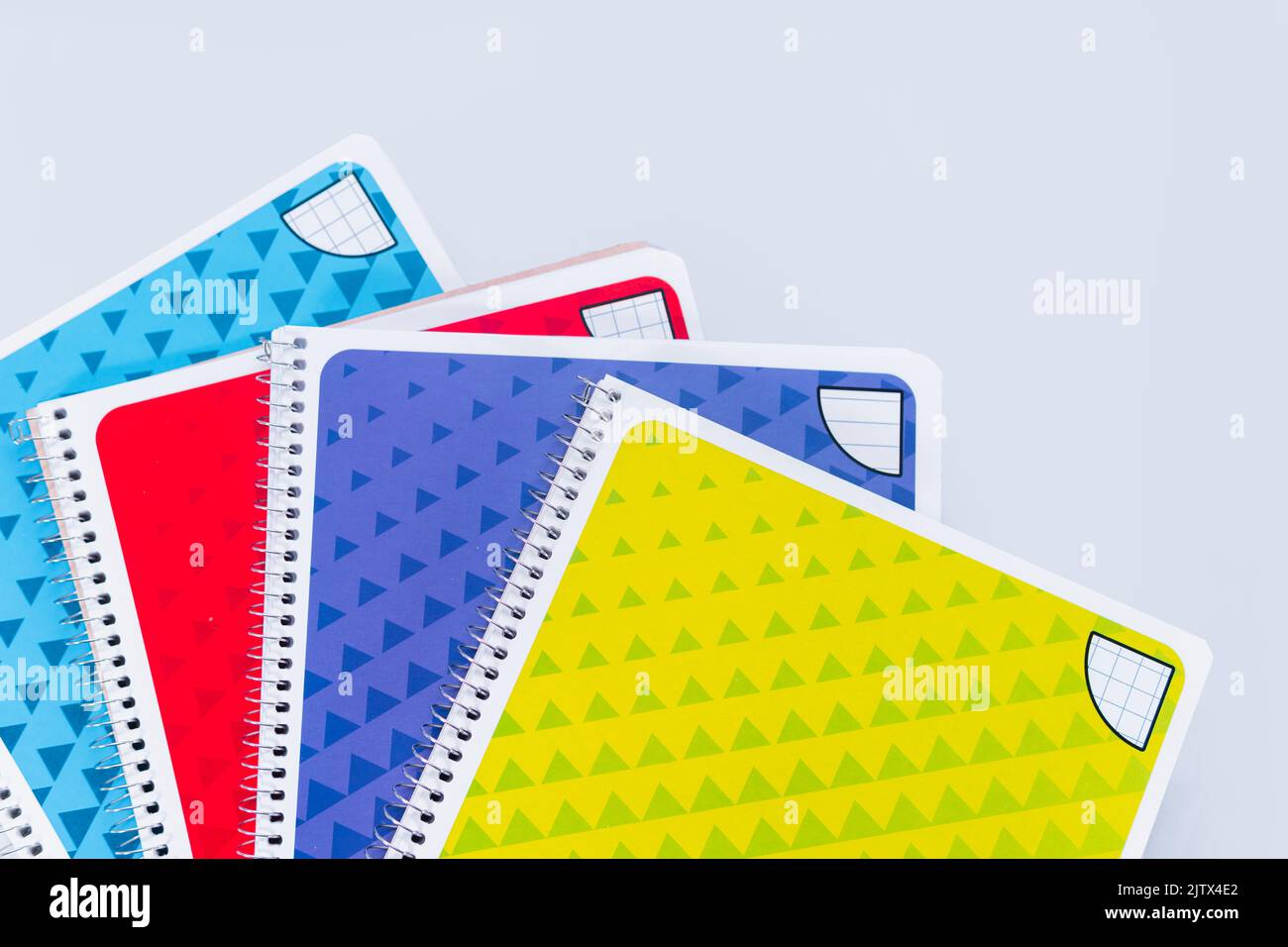 Colored notebooks on a white background with copy space. New notebooks ...