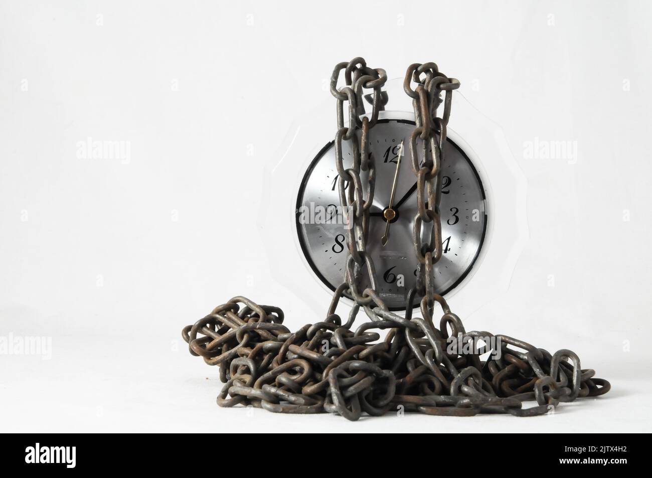 A retro vintage alarm chain clock isolated on a white background Stock ...