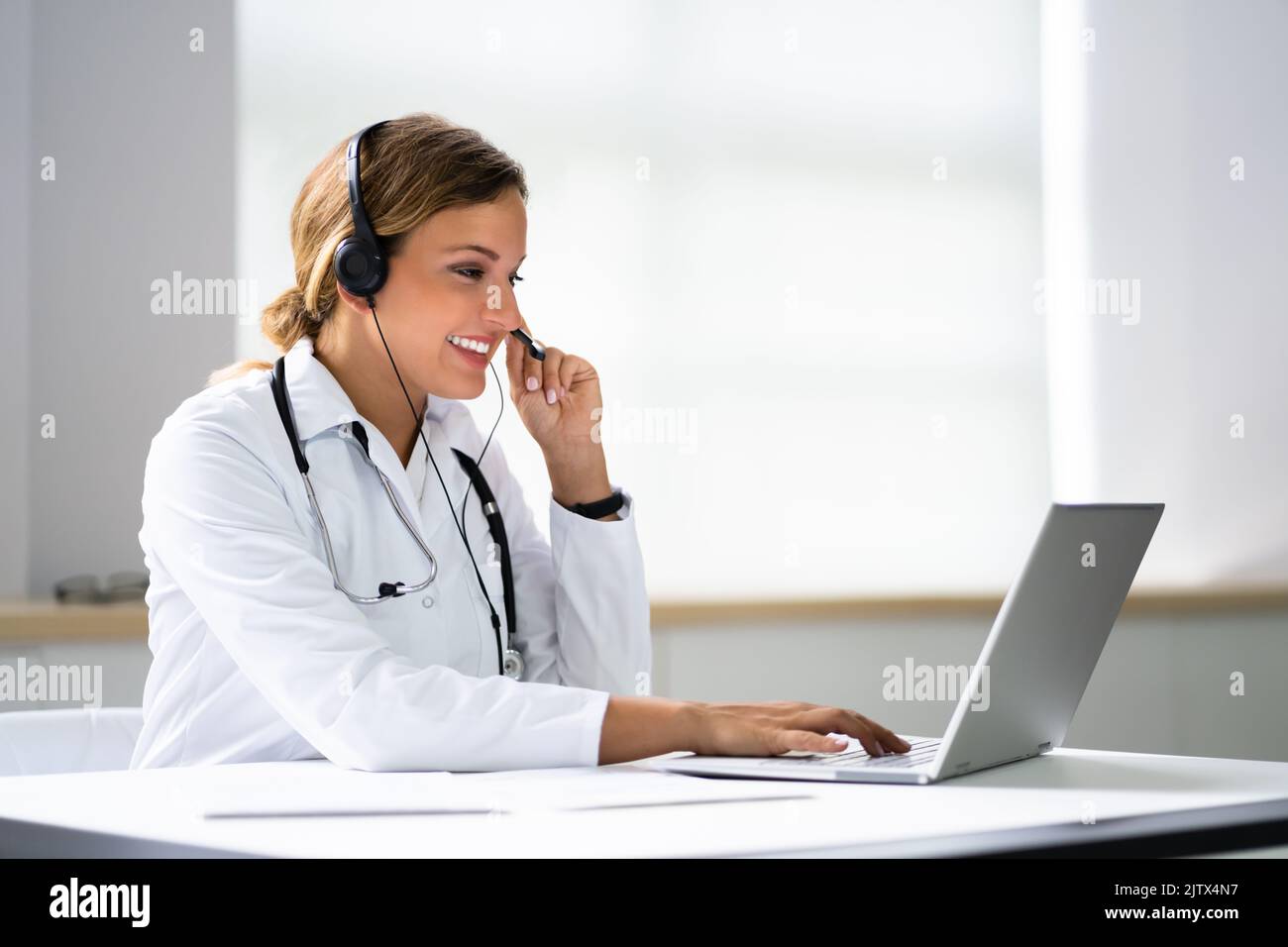 Happy Hospital Receptionist With Headset. Doctor Call Conference ...
