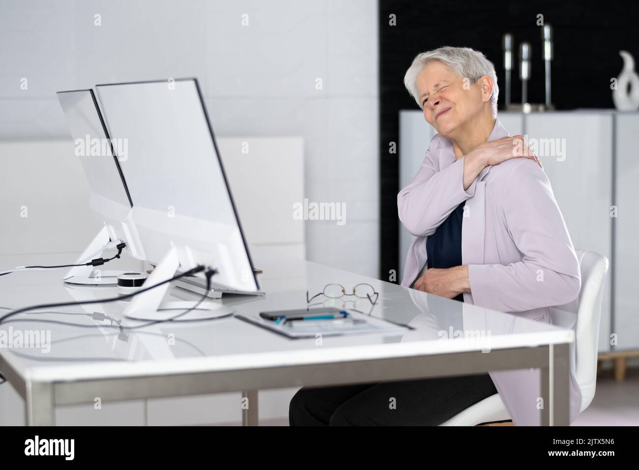 Neck Pain Bad Posture Stress At Computer In Office Stock Photo - Alamy