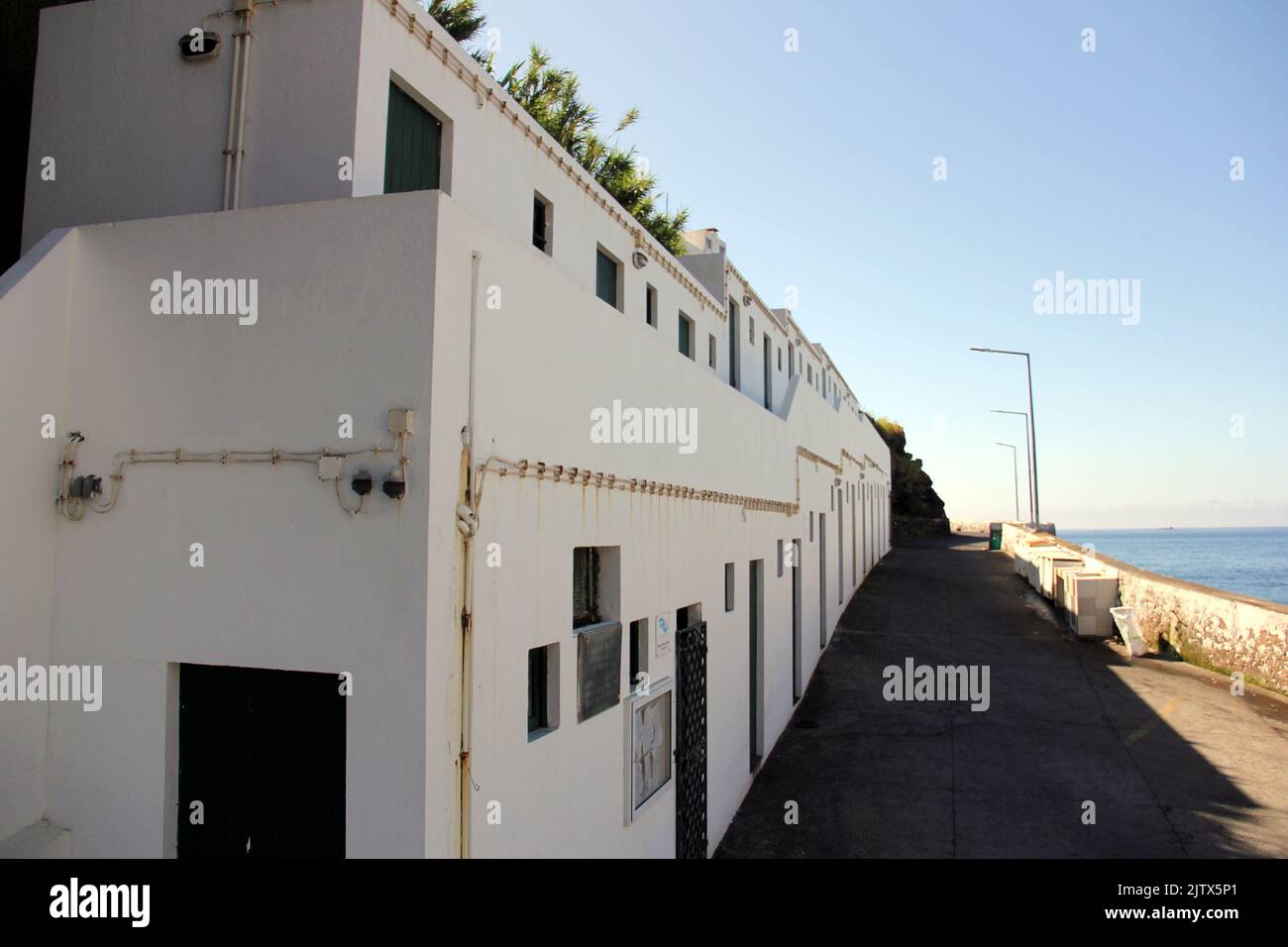 Row of whitewashed fishermen's storage and implements houses at the ...