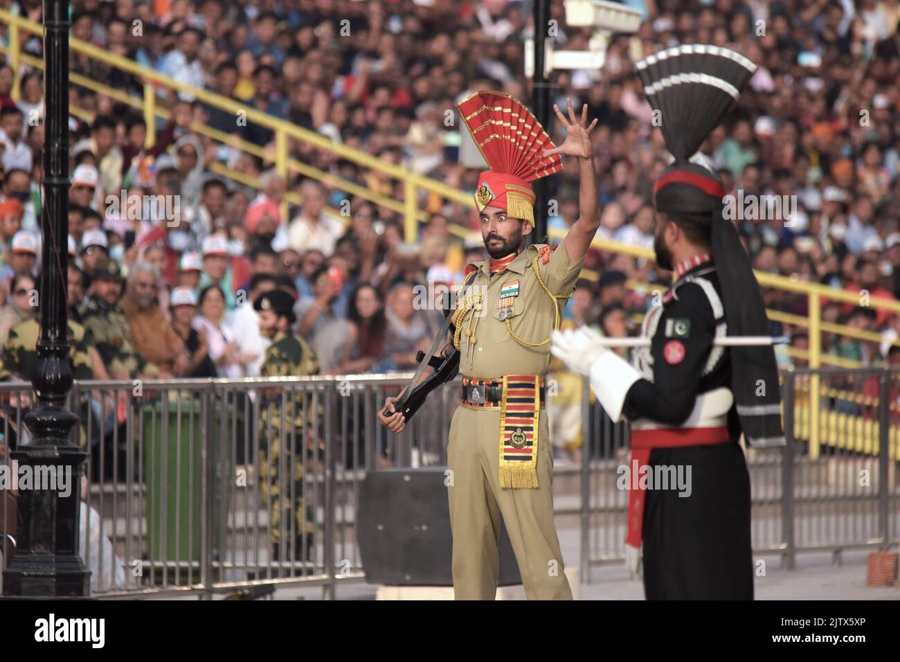 Ceremonial closing of gates and lowering of flags of India and Pakistan ...