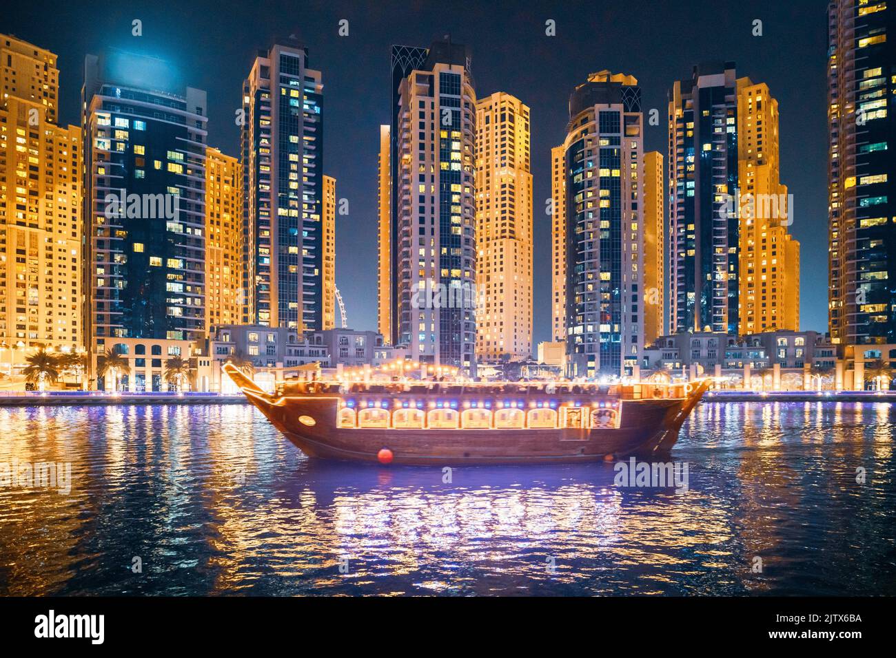 Tourist Boat, Sightseeing Boat Sailing On Dubai Marina At Nighttime ...