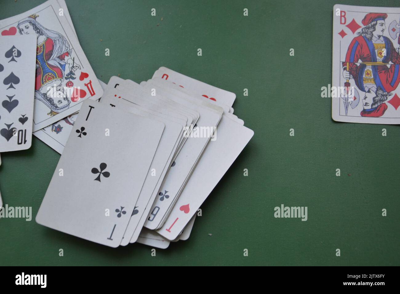 Playing cards at red table hi-res stock photography and images - Alamy