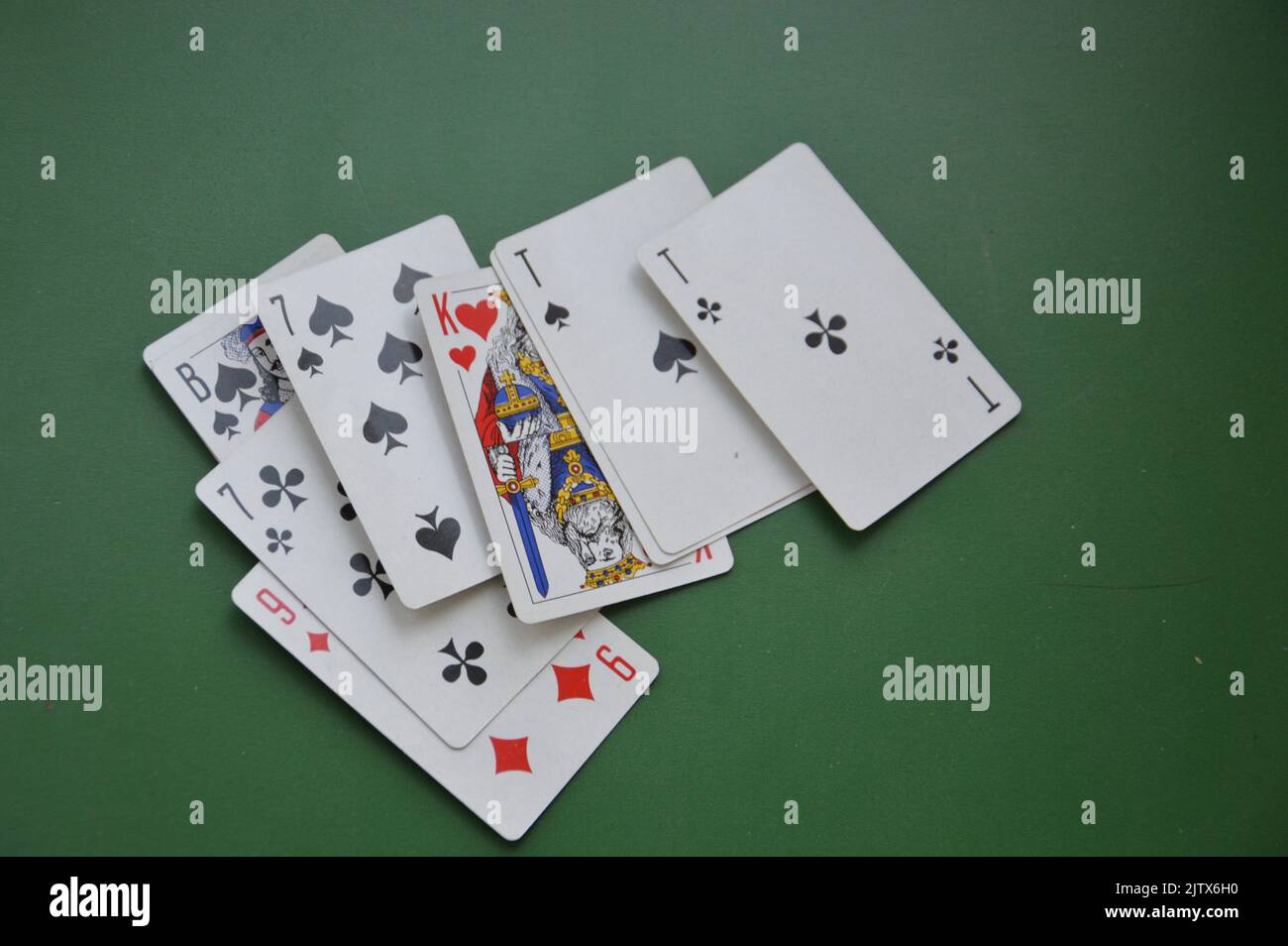 Playing cards at red table hi-res stock photography and images - Alamy