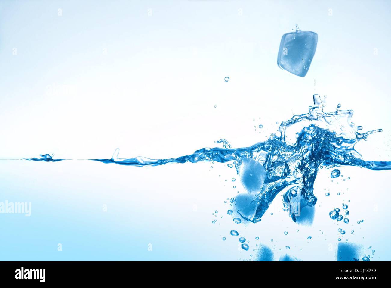 Ice cubes faling in water, high contrast Stock Photo - Alamy