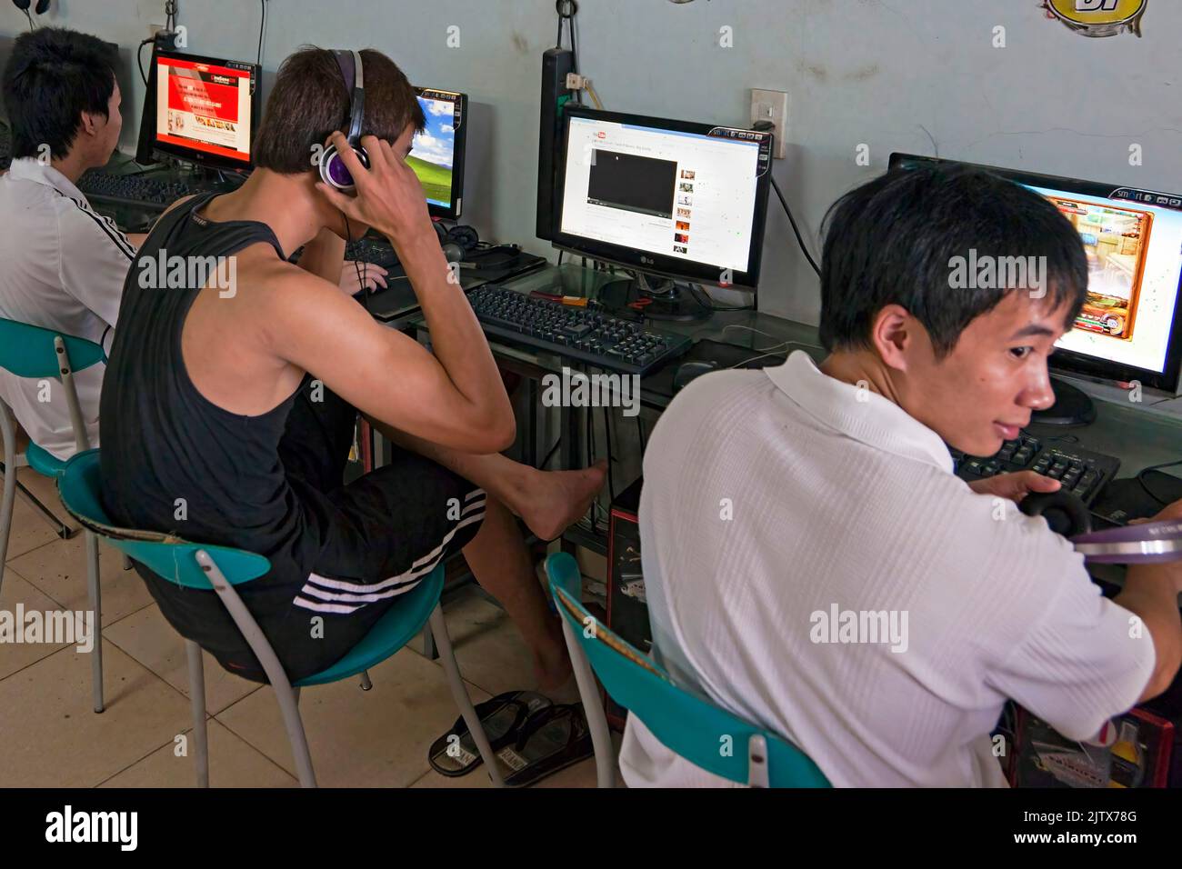 Vietnamese students using computers in internet shop, Hai Phong ...