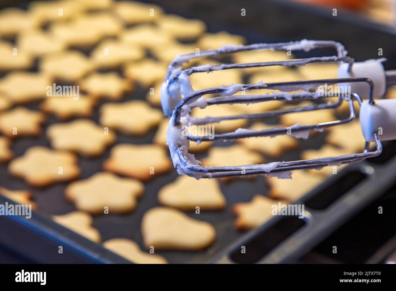 dirty rotating parts of a mixer with cream after whisking at blurred ...