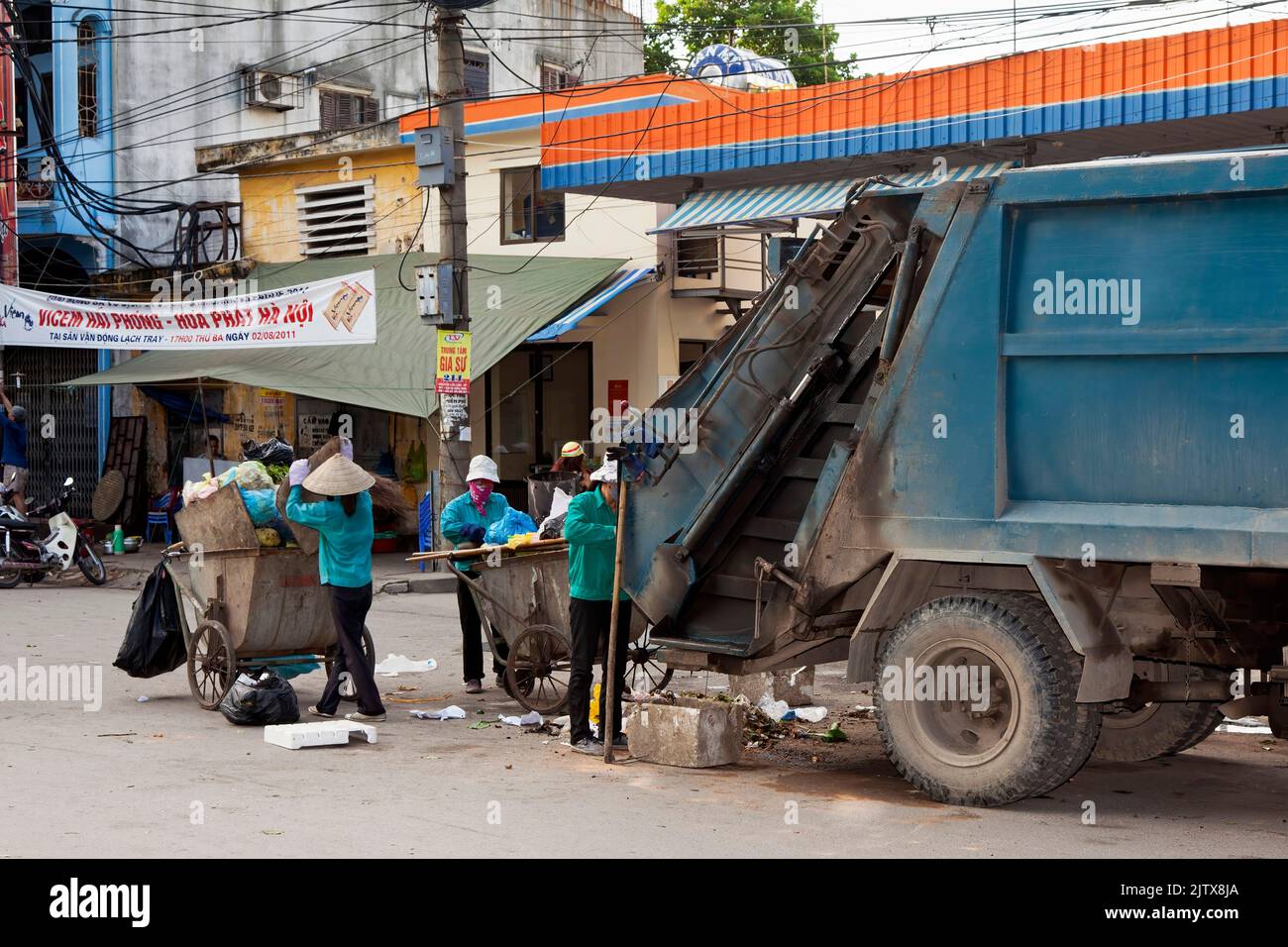 Municipal waste collection truck and workers, Hai Phong, Vietnam Stock ...