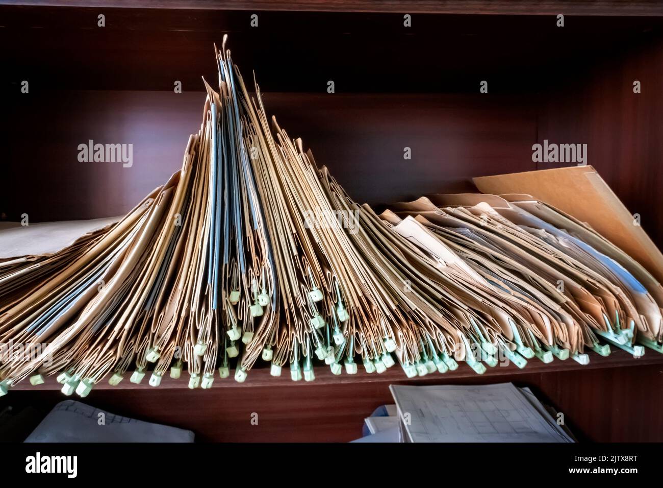 Old folders with documents in the library Stock Photo - Alamy