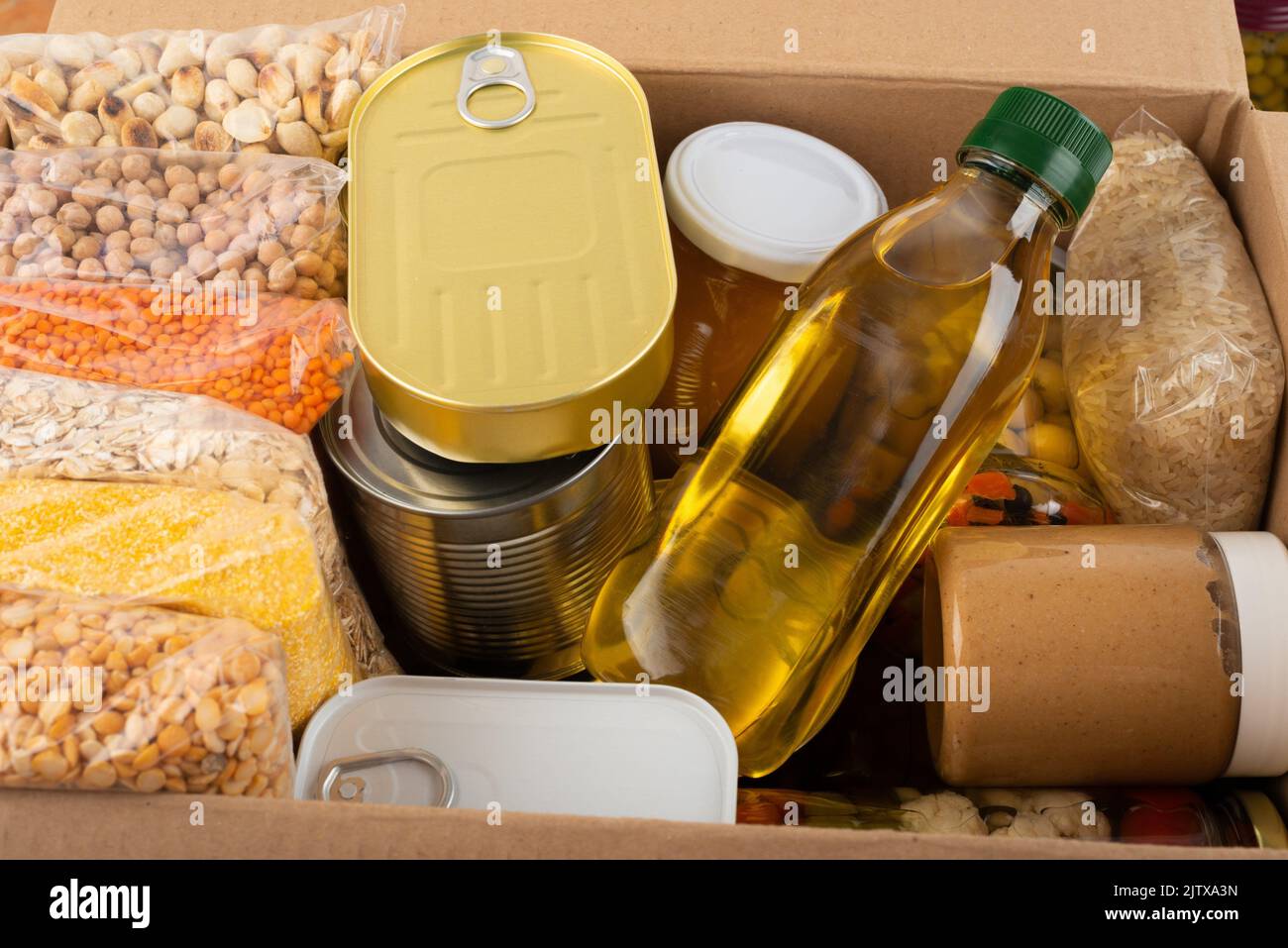 Survival set of nonperishable foods in carton box Stock Photo - Alamy