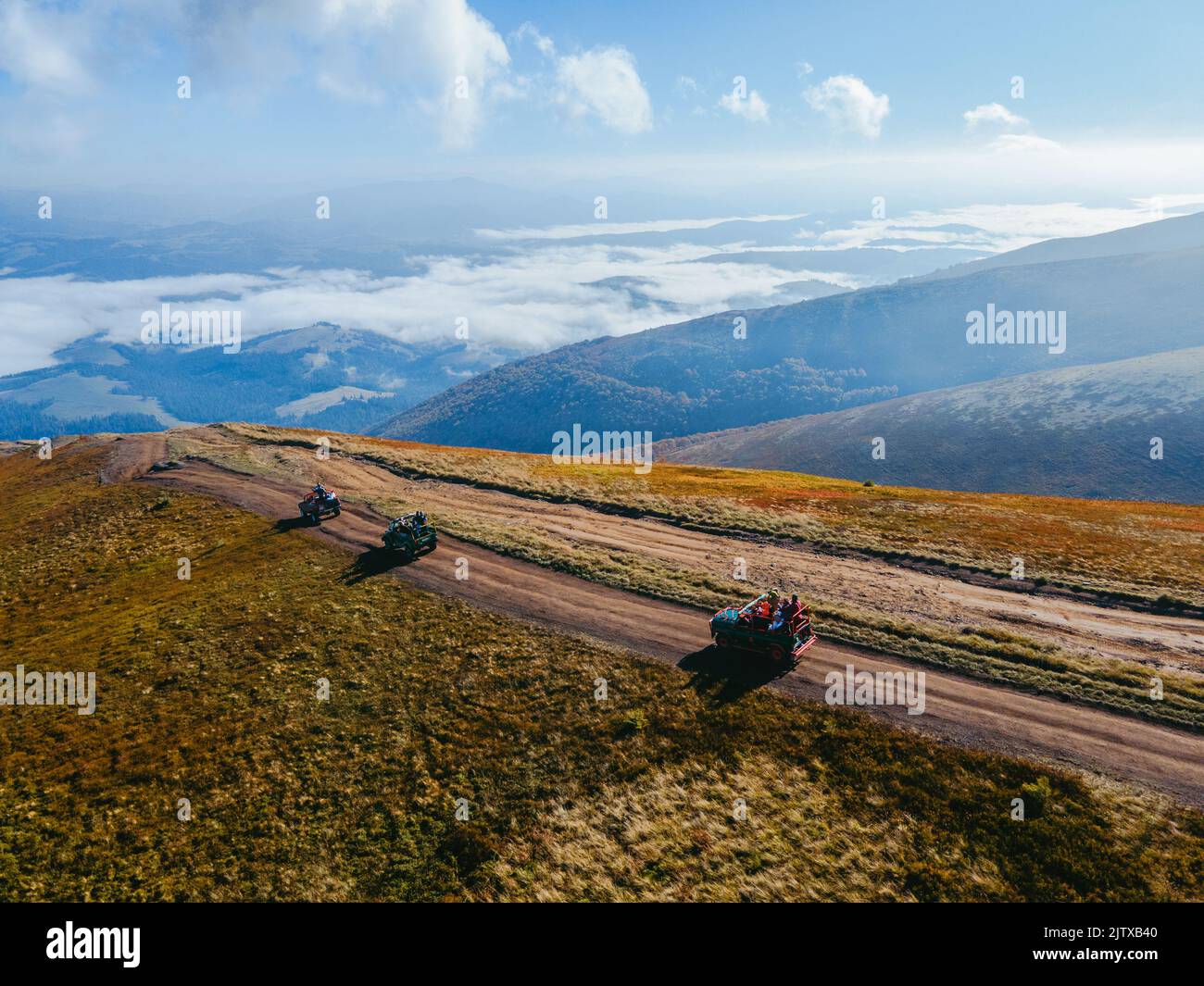 aerial view of suv off road travel climbing up by mountain hill Stock ...