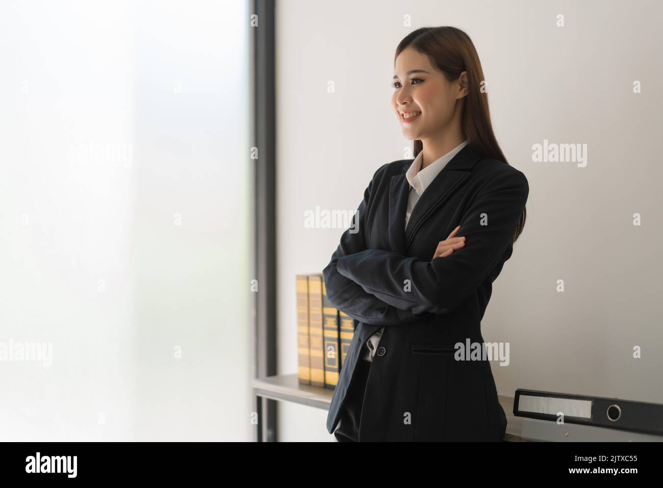 Law concept, Confident female lawyer standing with arms crossed and ...