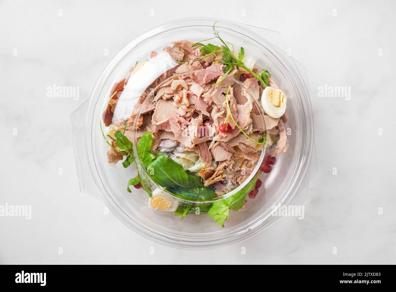 Plastic package with healthy baked ham salad for take away or food ...