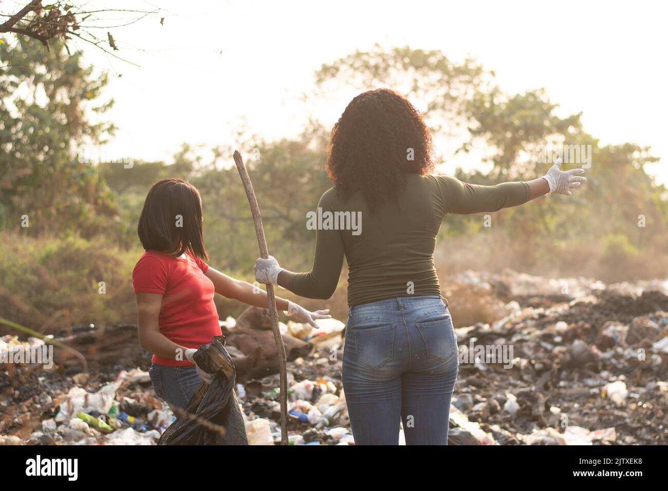 african women cleaning a refuse site Stock Photo - Alamy